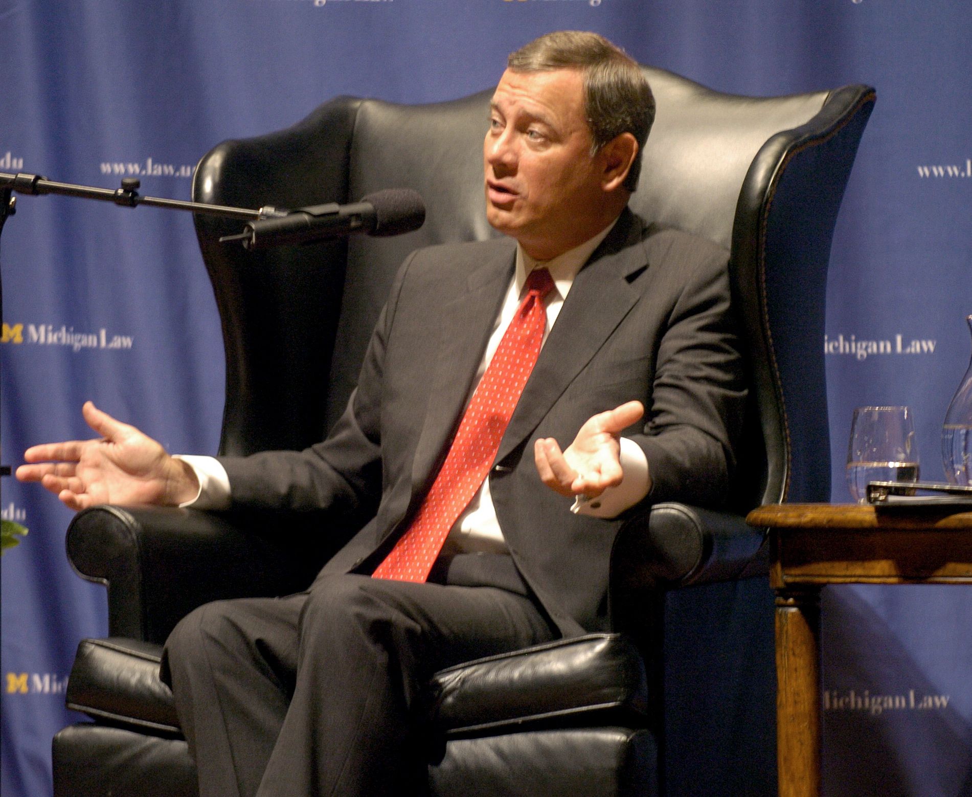 U.S. Supreme Court Chief Justice John Roberts helps University of ...