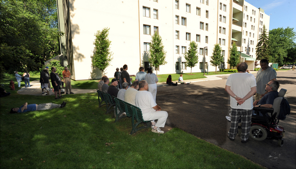 Ypsilanti firefighters pull unconscious man from burning apartment in ...