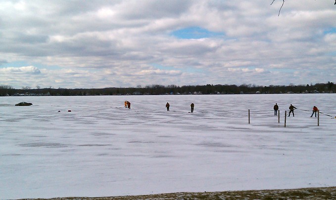 Woman rescued after driving onto frozen lake by mistake