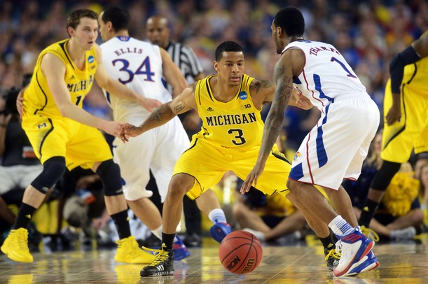 Images from Michigan's thrilling 87-85 overtime Sweet 16 win over Kansas