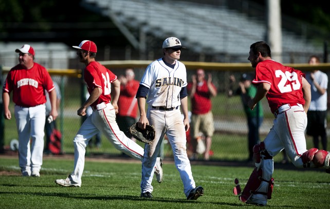 Images from the Saline baseball and softball teams' Monday playoff games