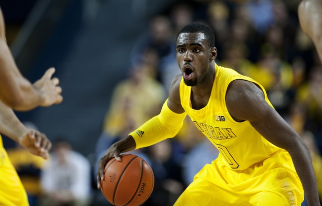 Images from No. 3 Michigan's 76-74 overtime victory over No. 10 Ohio State